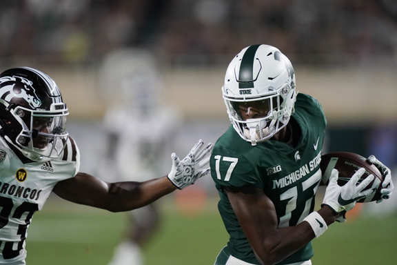 Michigan State Spartans sputter but still slide by Western Michigan, 35 ...